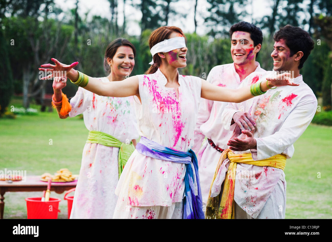Friends celebrating Holi Stock Photo - Alamy