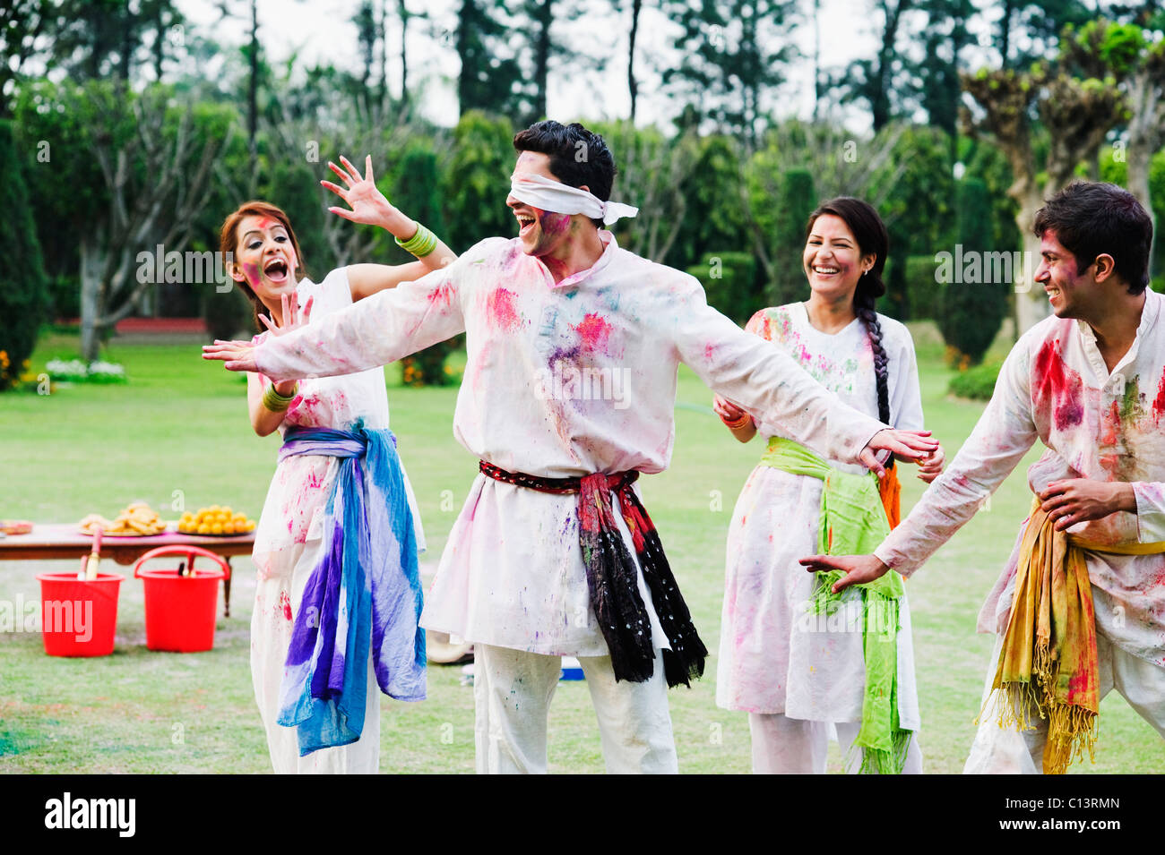 Friends celebrating Holi Stock Photo - Alamy