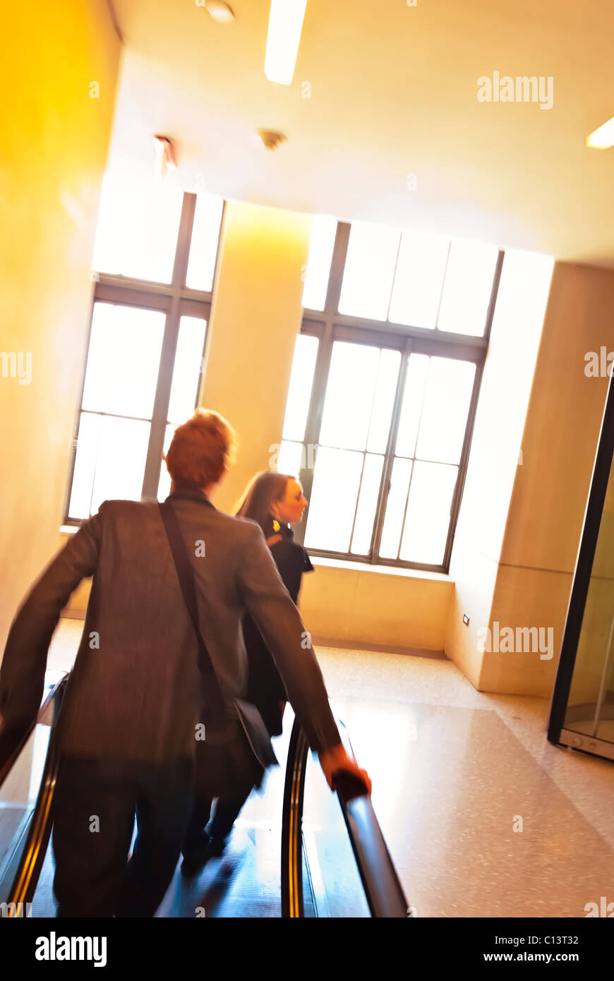 Professional riding up escalator hi-res stock photography and images ...