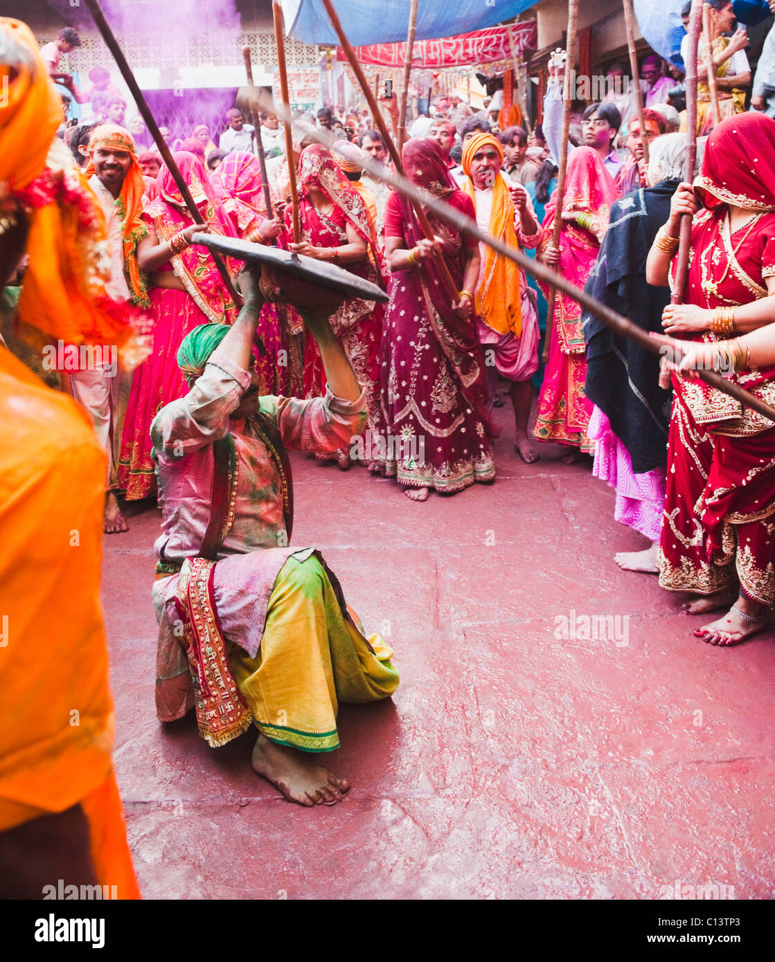 People celebrating 'Lath Maar Holi' festival, Barsana, Uttar Pradesh ...