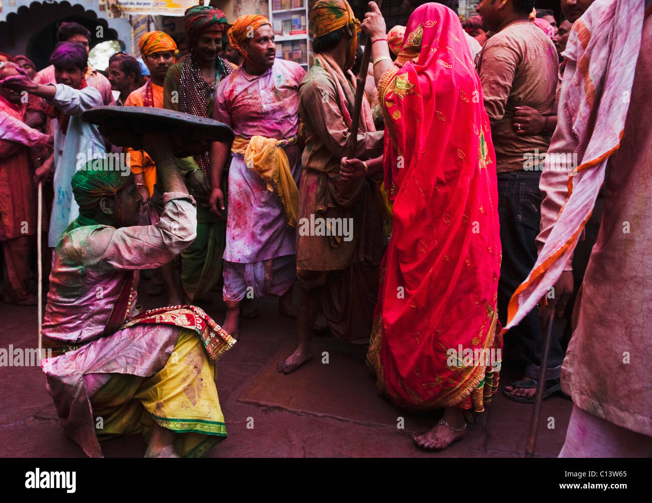 People celebrating 'Lath Maar Holi' festival, Barsana, Uttar Pradesh ...