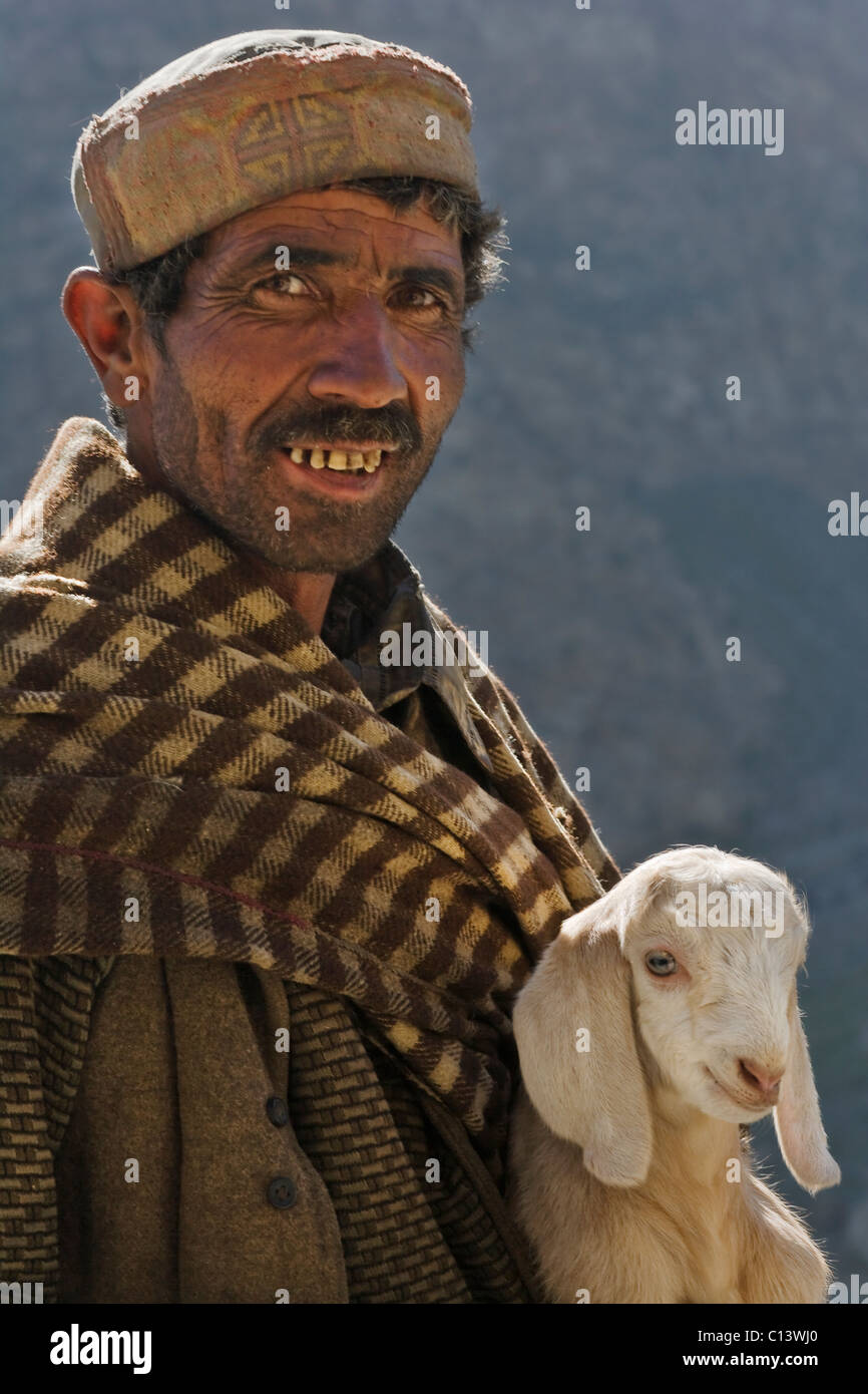 Man holding lamb in the Himalayas, India Stock Photo - Alamy
