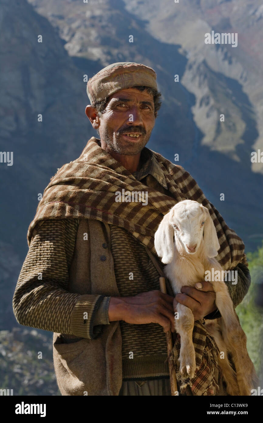 Man holding lamb in the Himalayas, India Stock Photo - Alamy