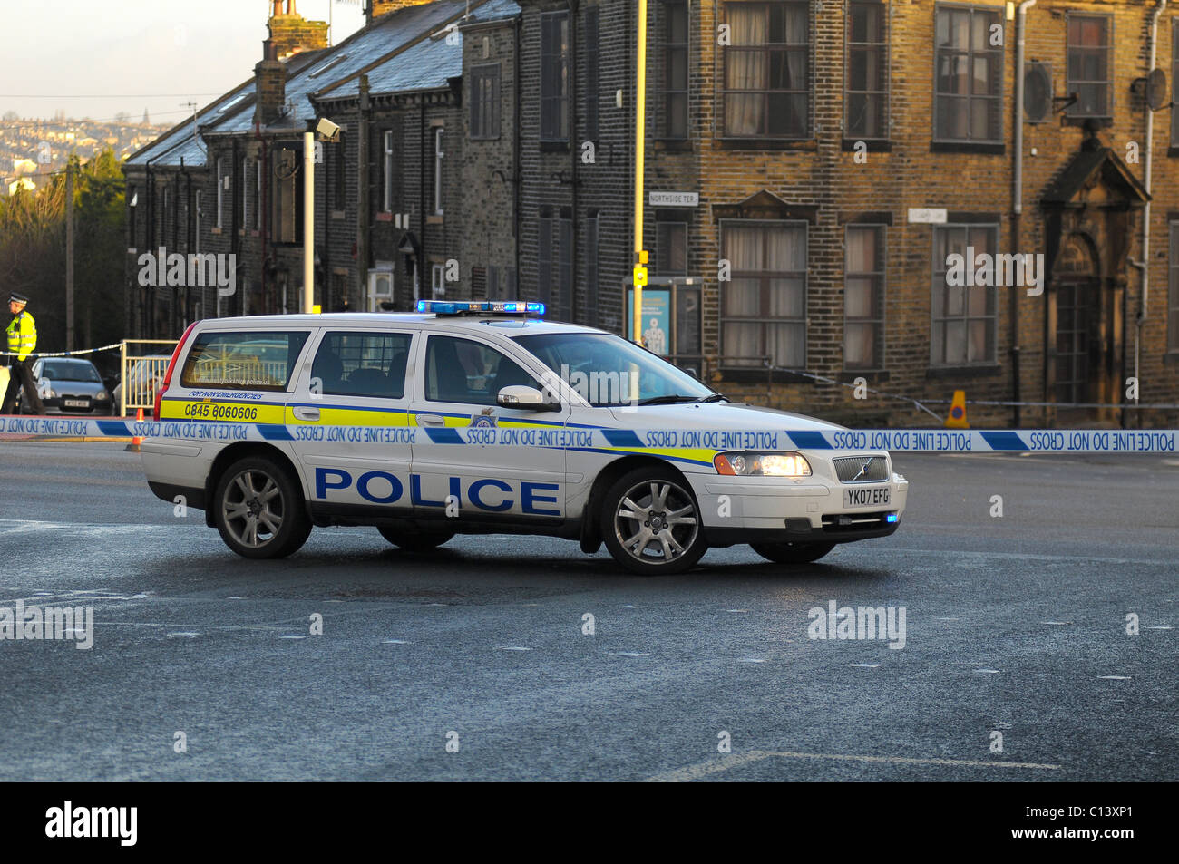 Police car blocks the road after an accident Stock Photo - Alamy