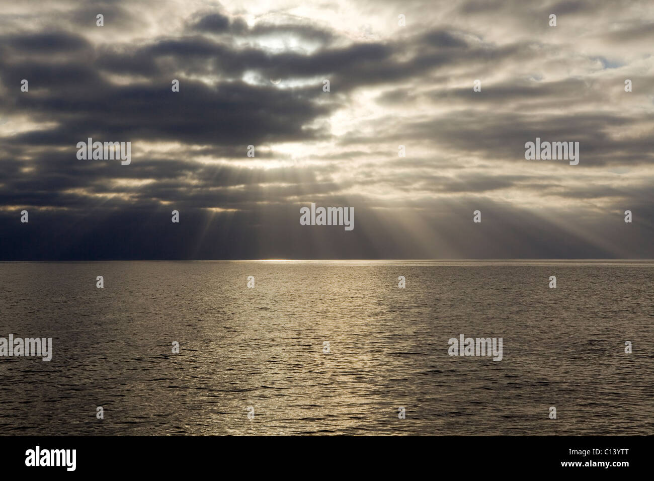 Rays of sun illuminate the surface of the open ocean Stock Photo - Alamy