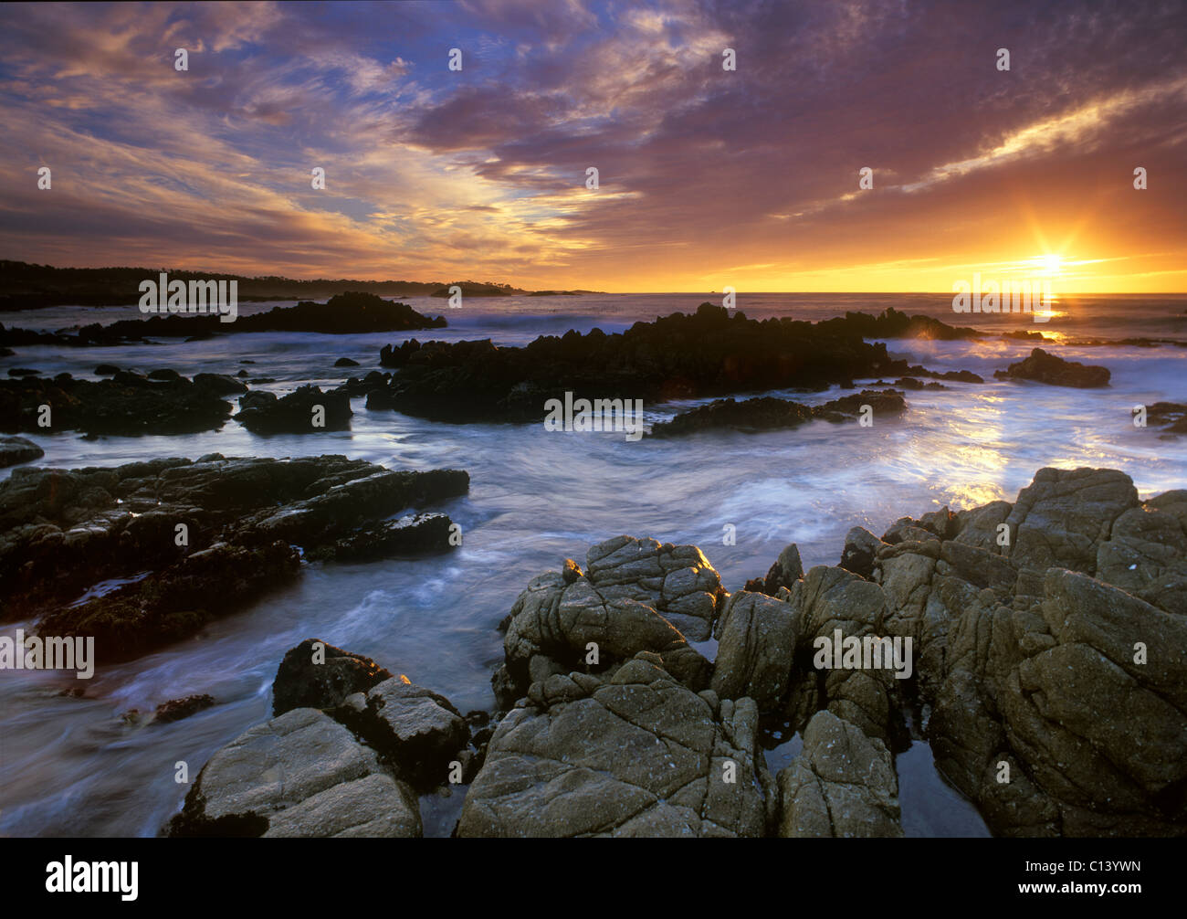Sunset along Pebble Beach, California Stock Photo - Alamy
