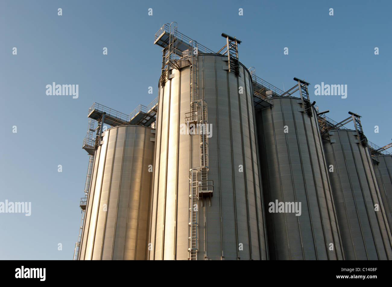 shining gas tanks with blue sky Stock Photo - Alamy