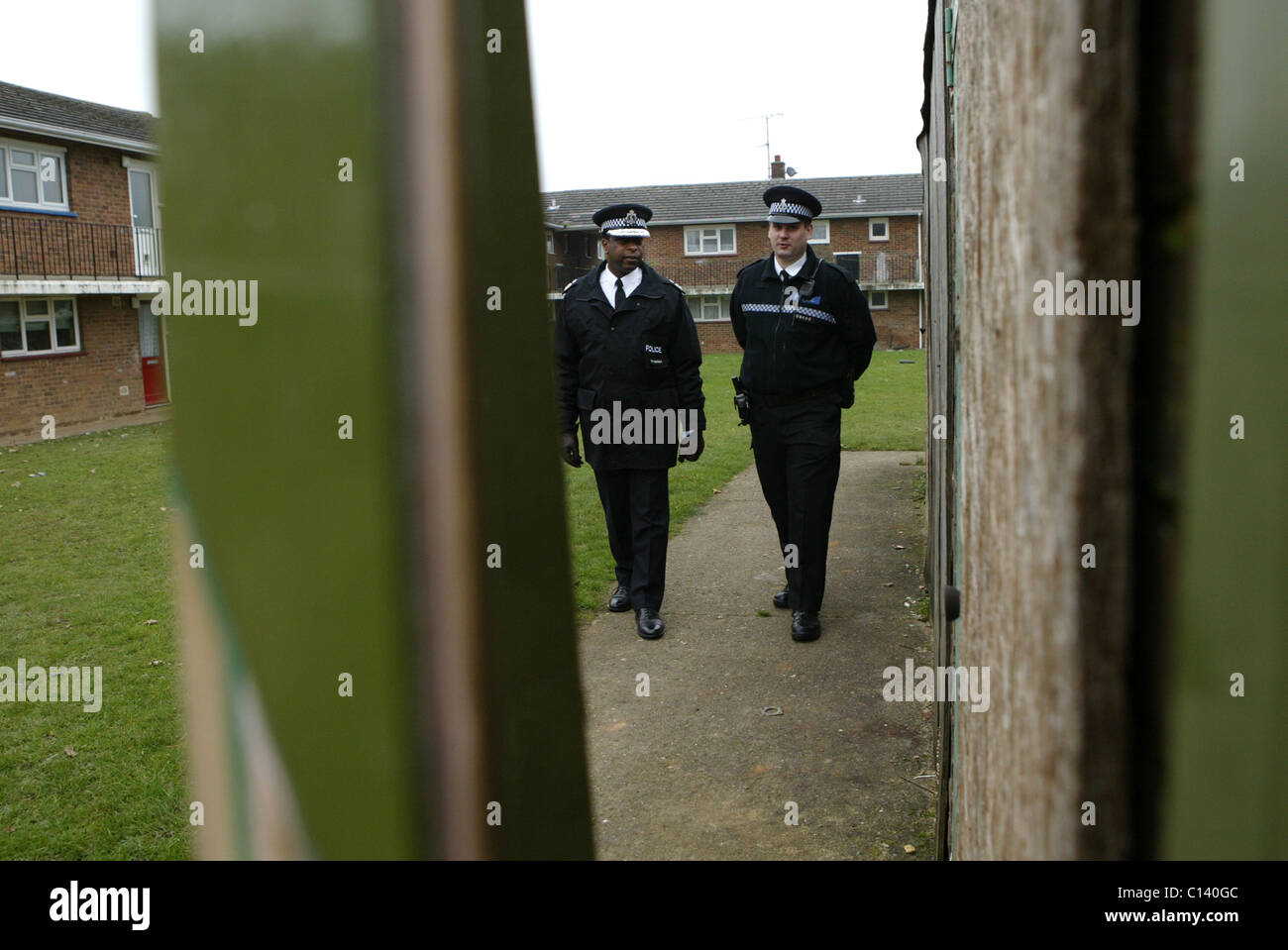 Two British police officers patrolling a housing estate Stock Photo - Alamy