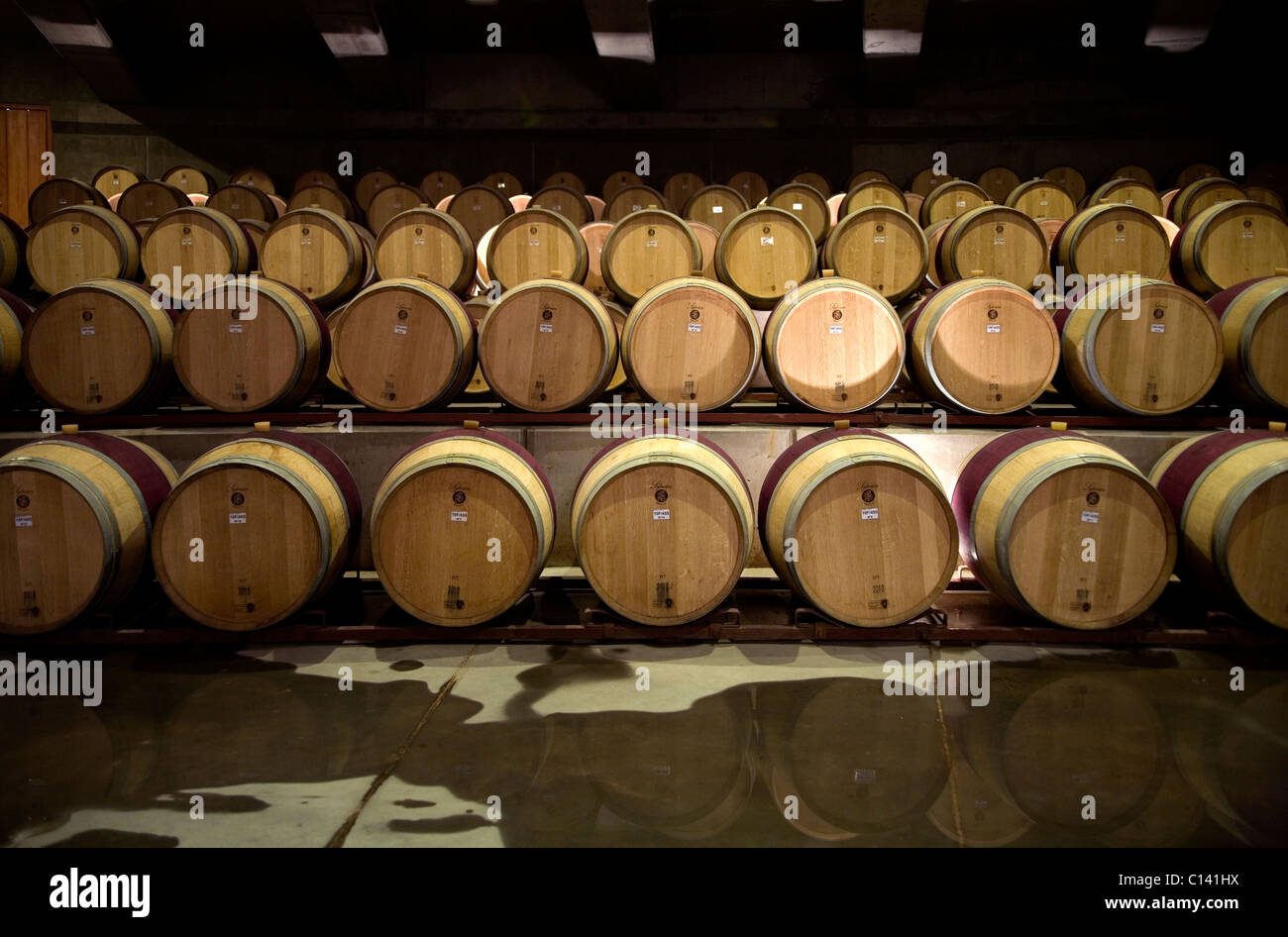 Cellar full of barrels maturing excellent wine at controlled ...