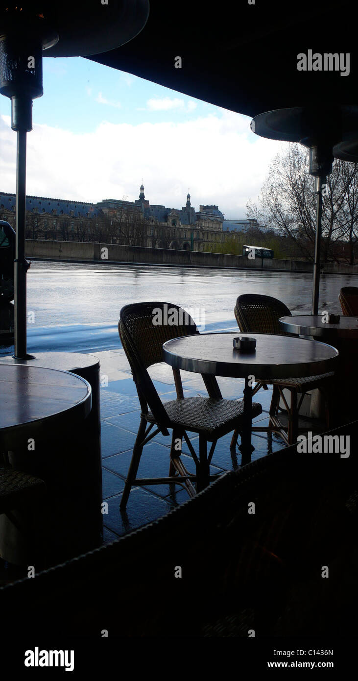 French cafe windy day Paris tables silhouettes Stock Photo - Alamy