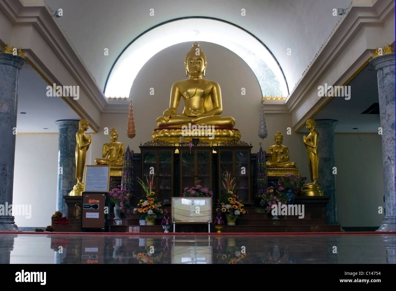 Ornate and detailed gold Buddhist sculptures decorate a beautiful ...