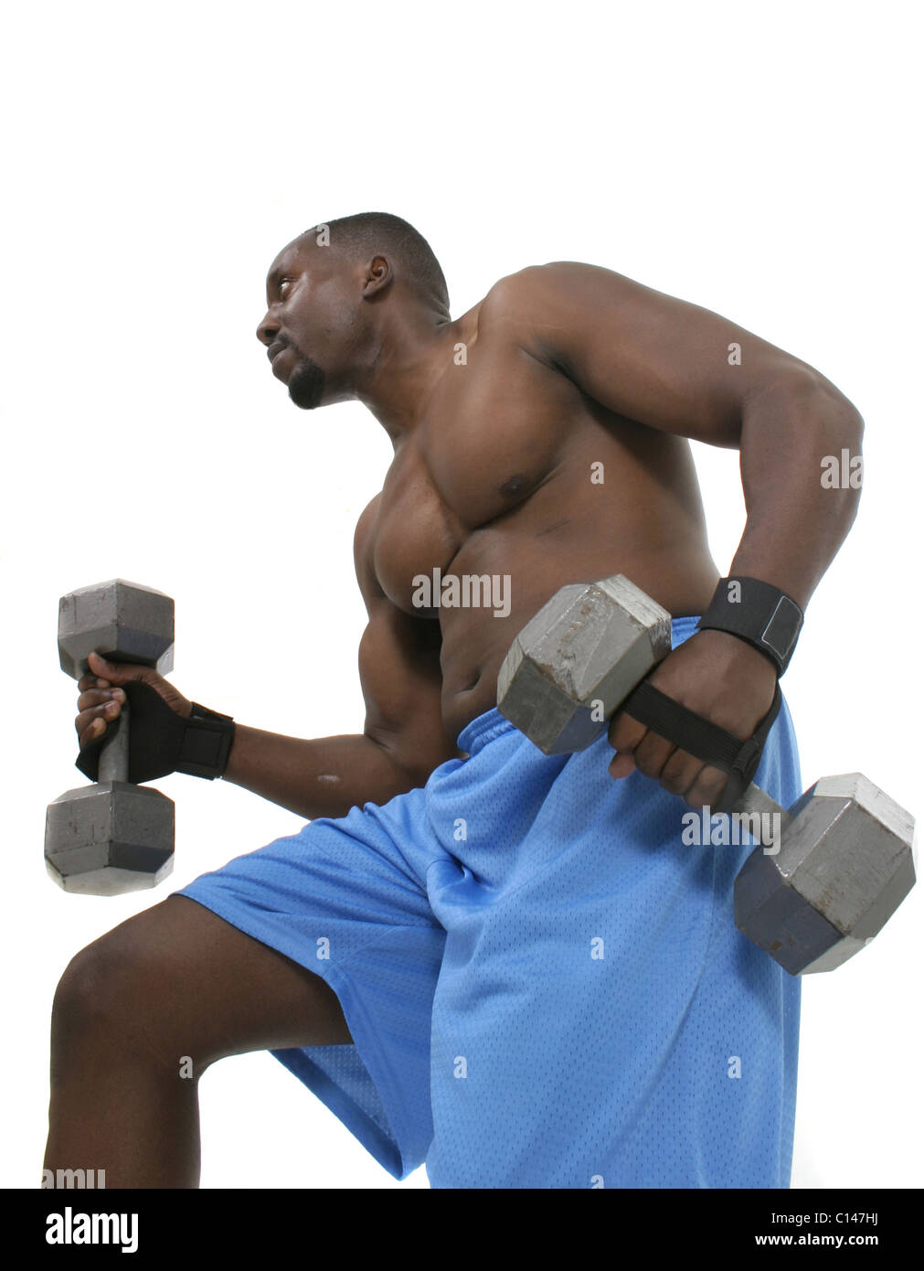Handsome male with bulging muscles lifting weights Stock Photo - Alamy