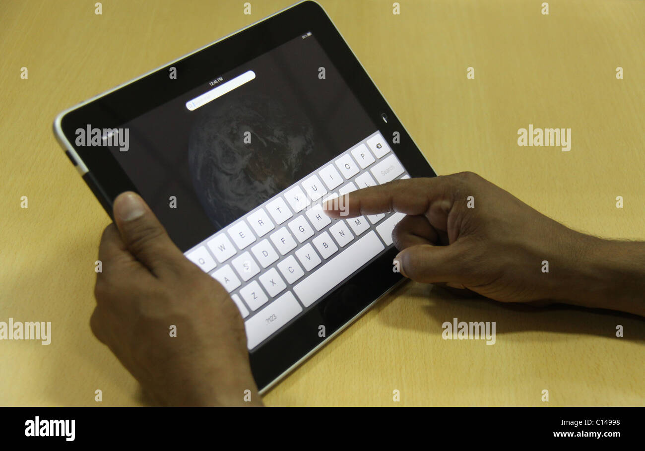 Man using iPad Stock Photo - Alamy