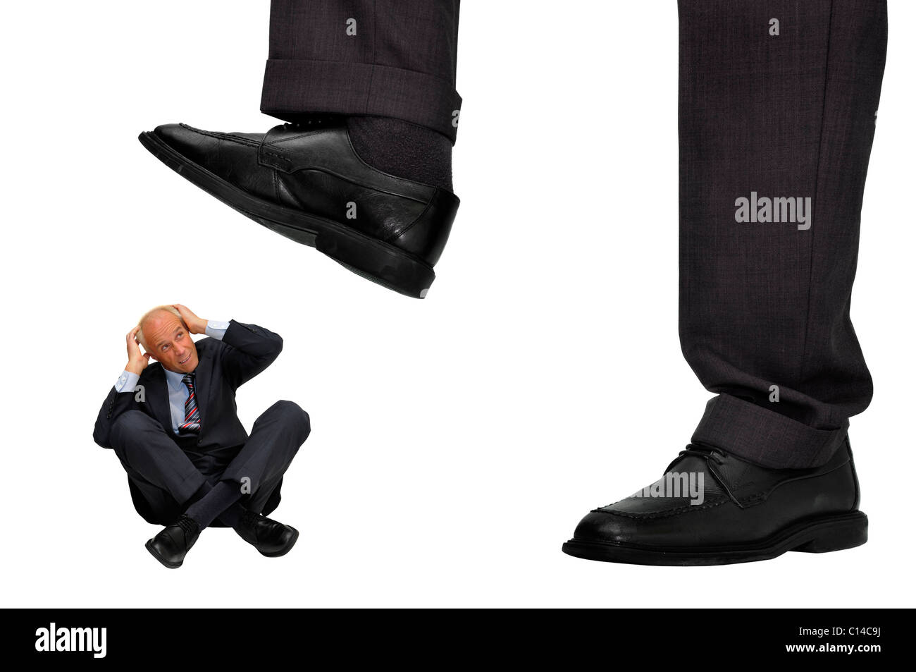 Mature businessman afraid of big CEO isolated in white Stock Photo - Alamy