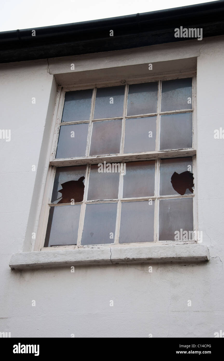 Sash window in Victorian Building broken glass Stock Photo - Alamy