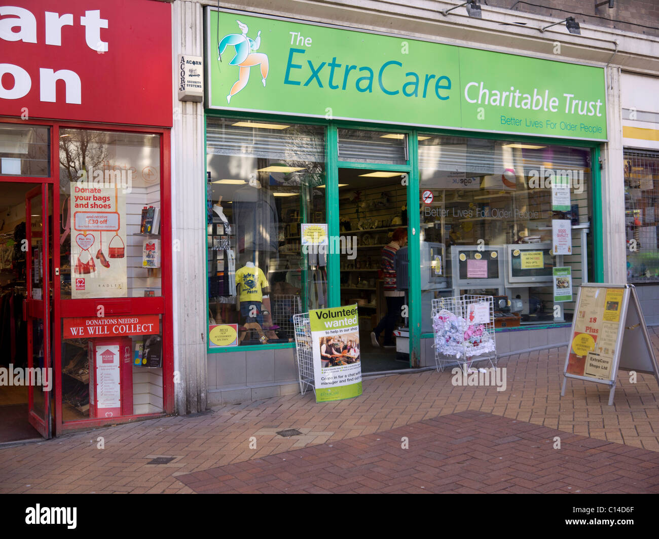 Exterior of Charity shop, Extra Care Stock Photo - Alamy