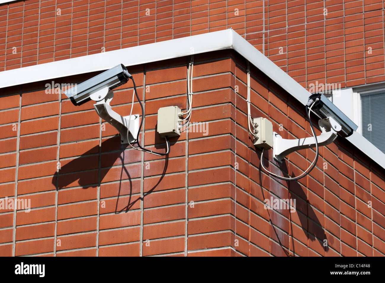 Surveillance cameras on building exterior Stock Photo - Alamy
