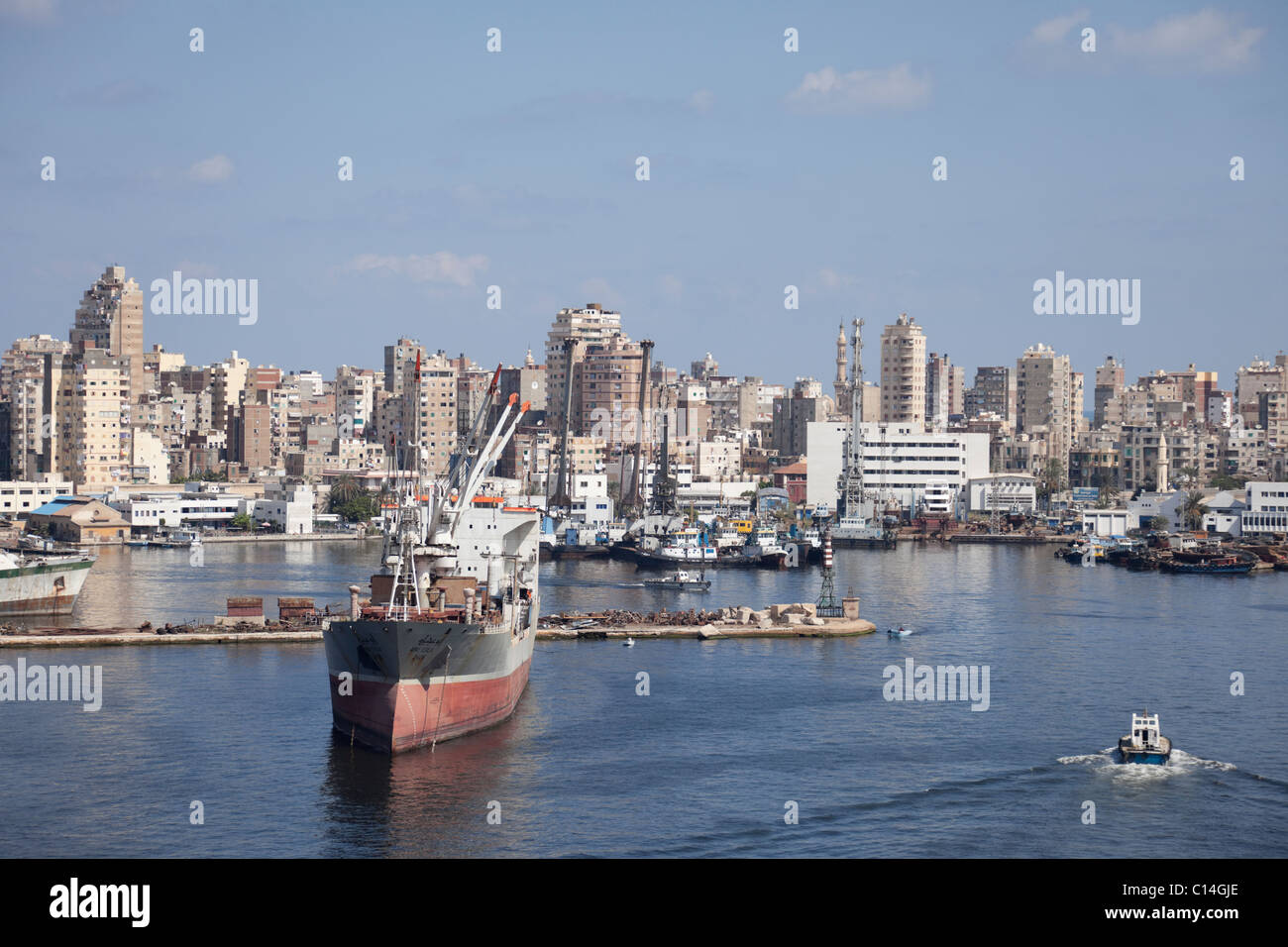 Ships mooring in the port of Alexandria with cityscape in the ...