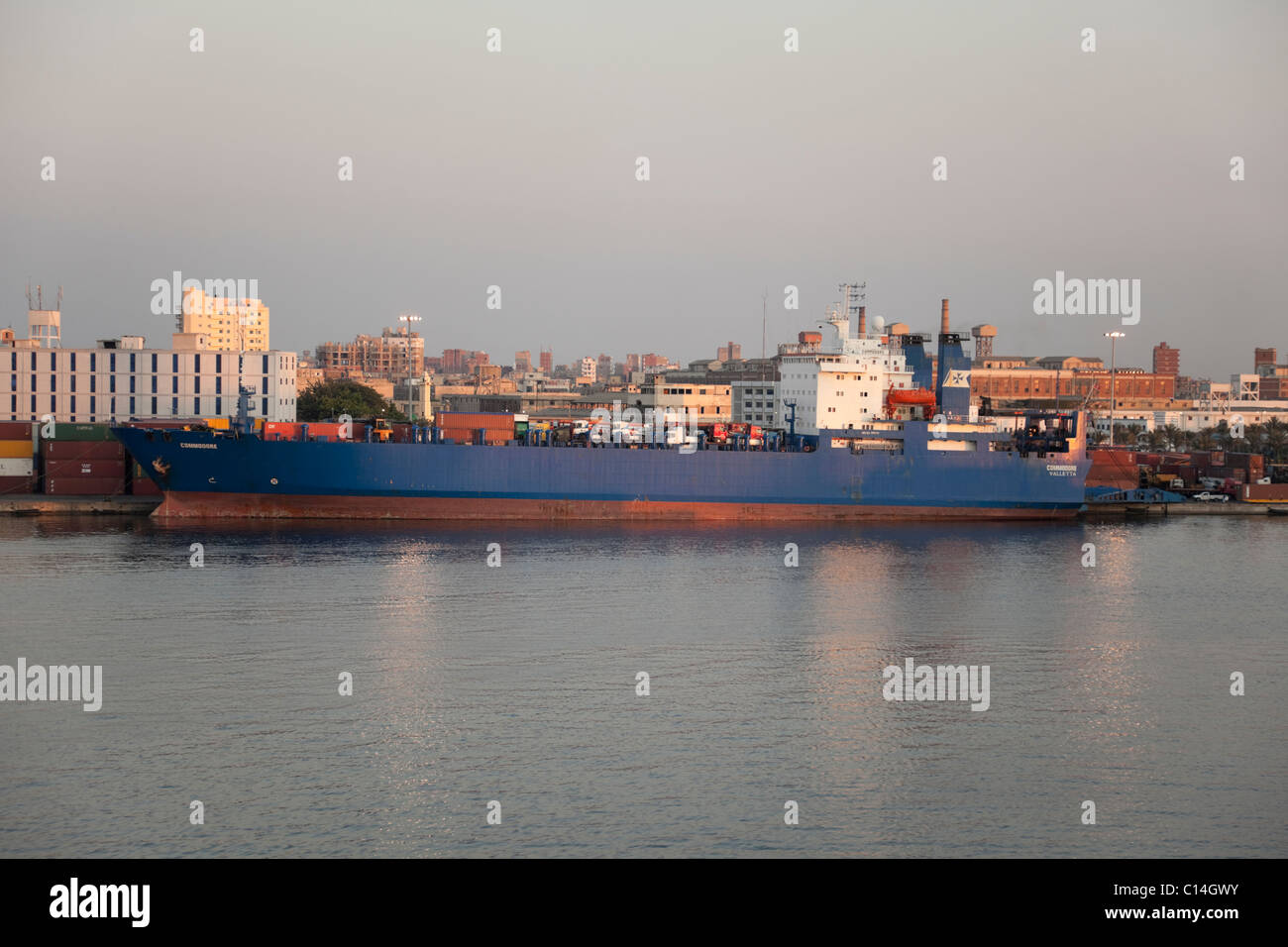 Container ship in the port of Alexandria, Egypt at sunset Stock Photo ...