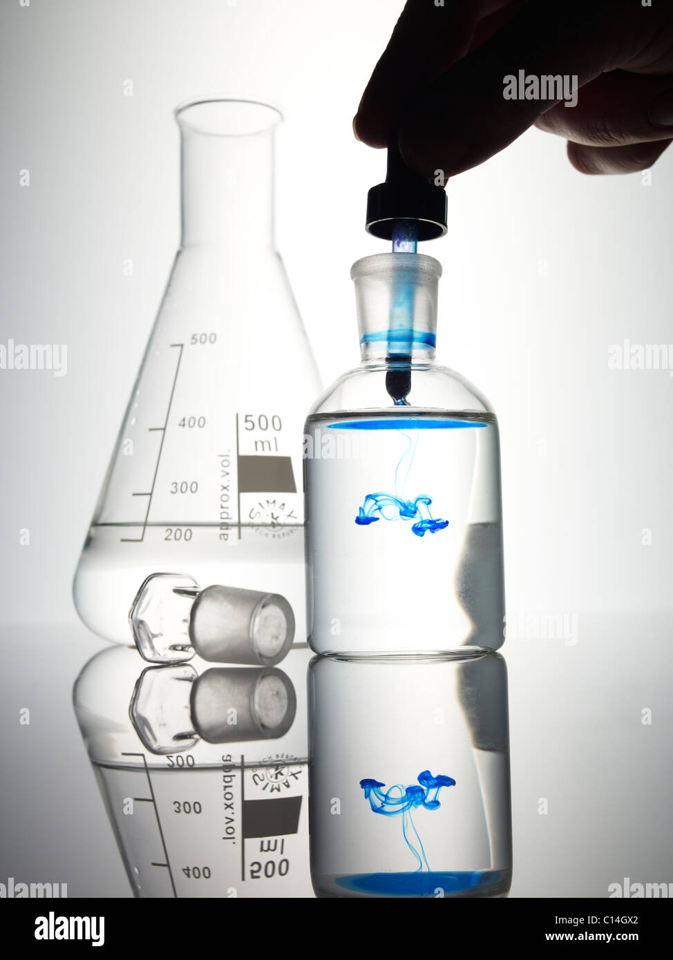lab flask on a white background Stock Photo - Alamy