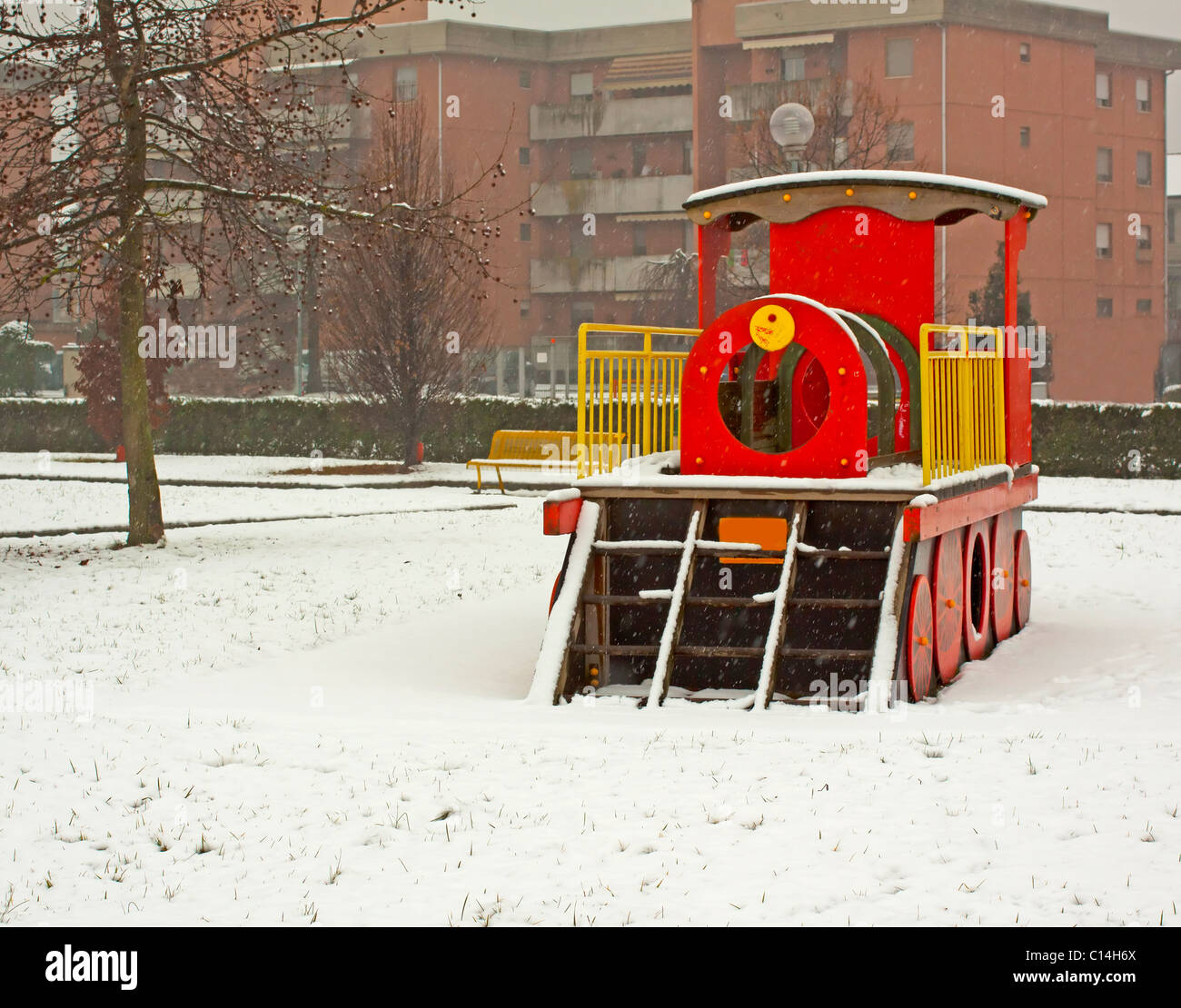 Little toy locomotive in the snow of a park Stock Photo - Alamy