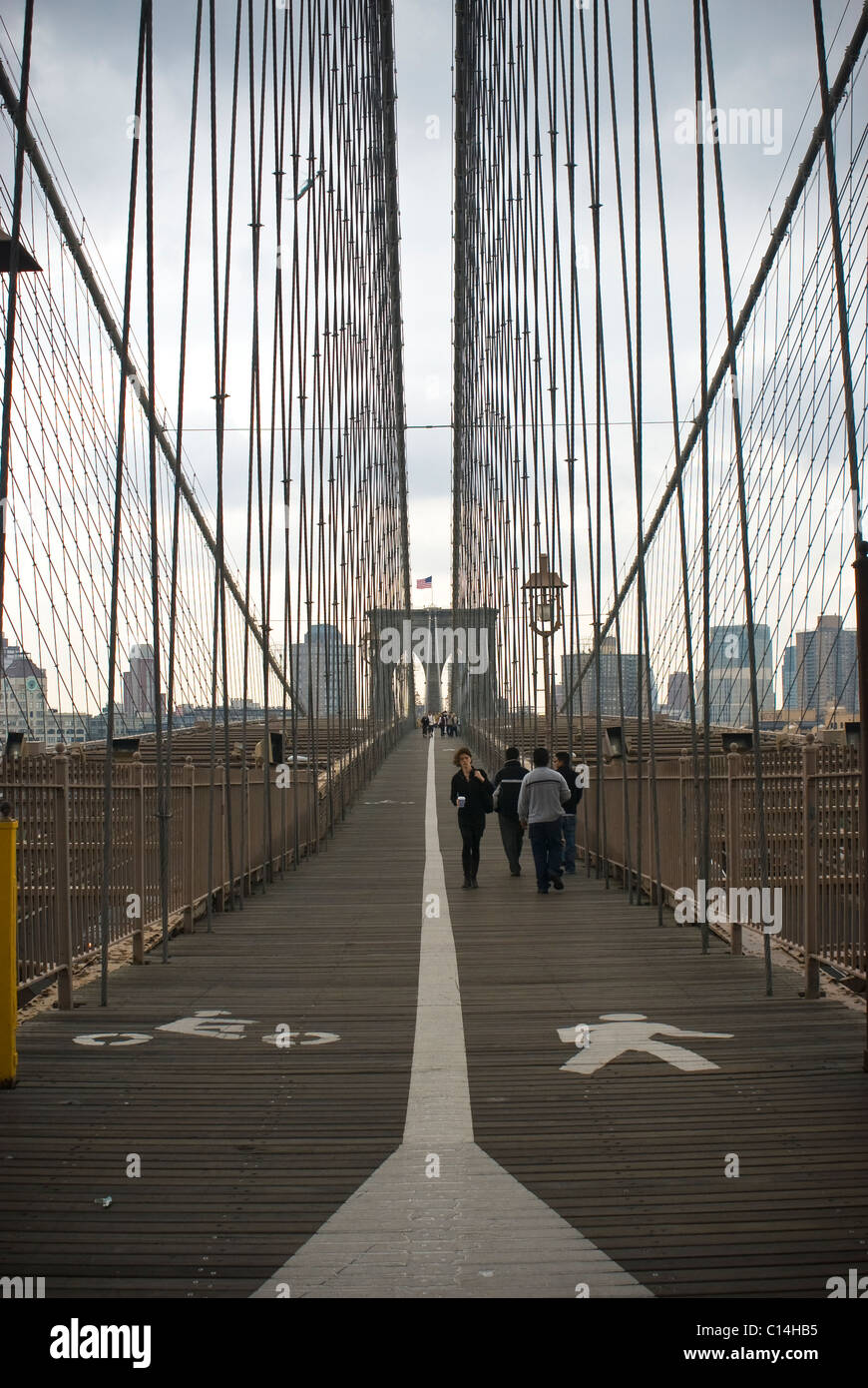 The walkway and cycle path on the Brooklyn Bridge leading into downtown ...