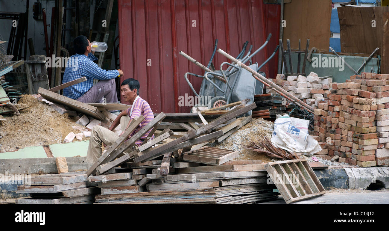 Men at building site Stock Photo - Alamy