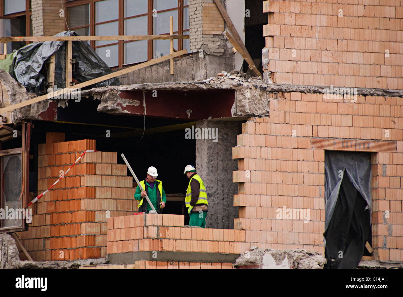 workers during the reconstruction of a building Stock Photo - Alamy