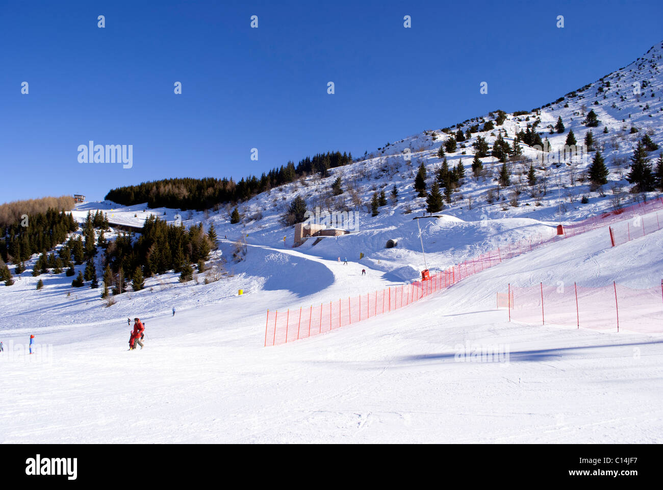 skiers on ski slope with a snowboard Stock Photo - Alamy