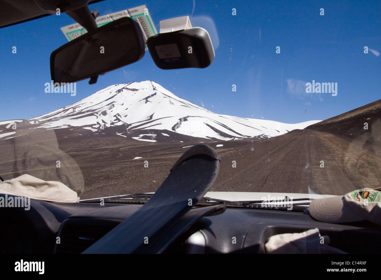 Volcan Lonquimay in Chile seen through the windshield of a car Stock ...