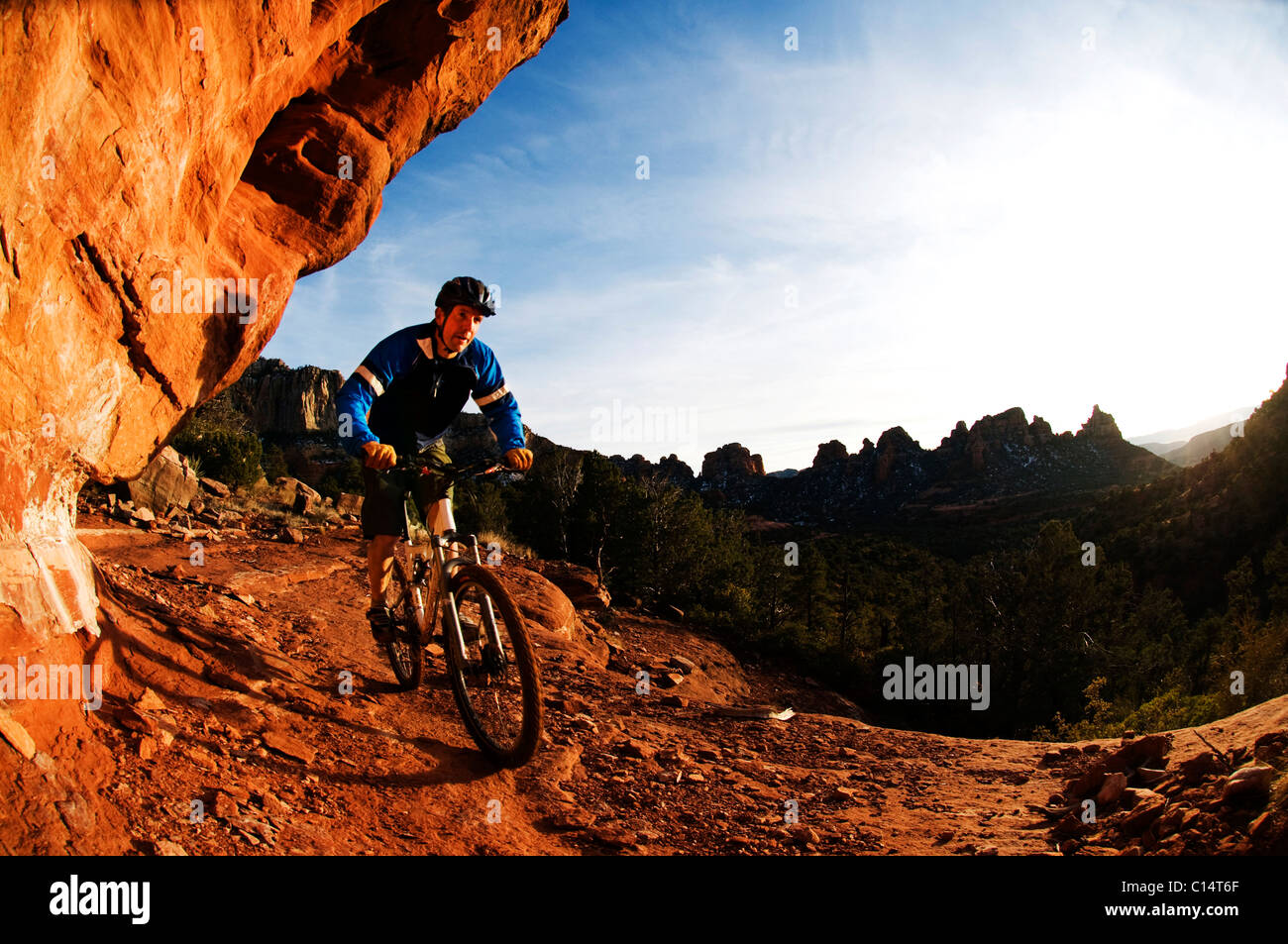 A man taking a bike ride on a rocky trail Stock Photo - Alamy