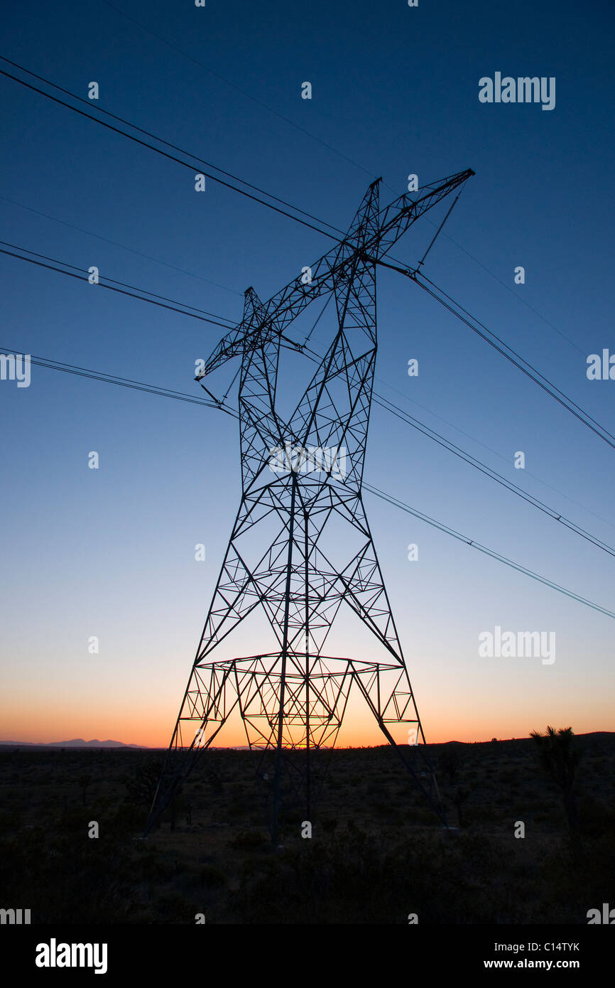 Power transmission towers and lines at sunset Stock Photo - Alamy