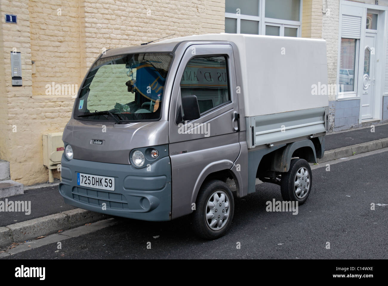 A two tone Ligier X Pro small van in the pretty French village of ...