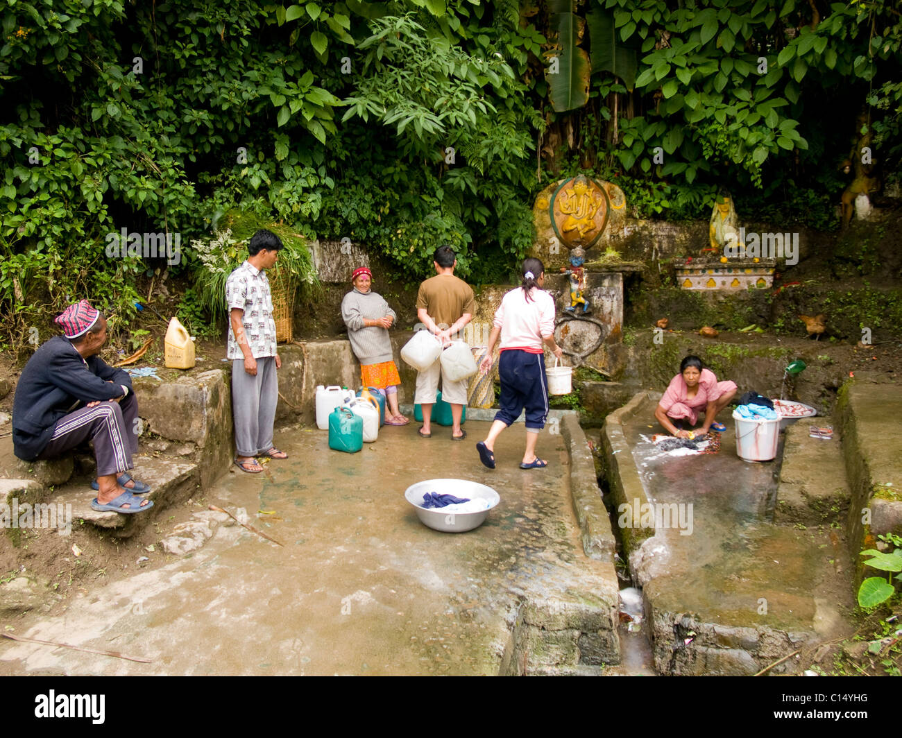 Young indian woman washing clothes hi-res stock photography and images ...