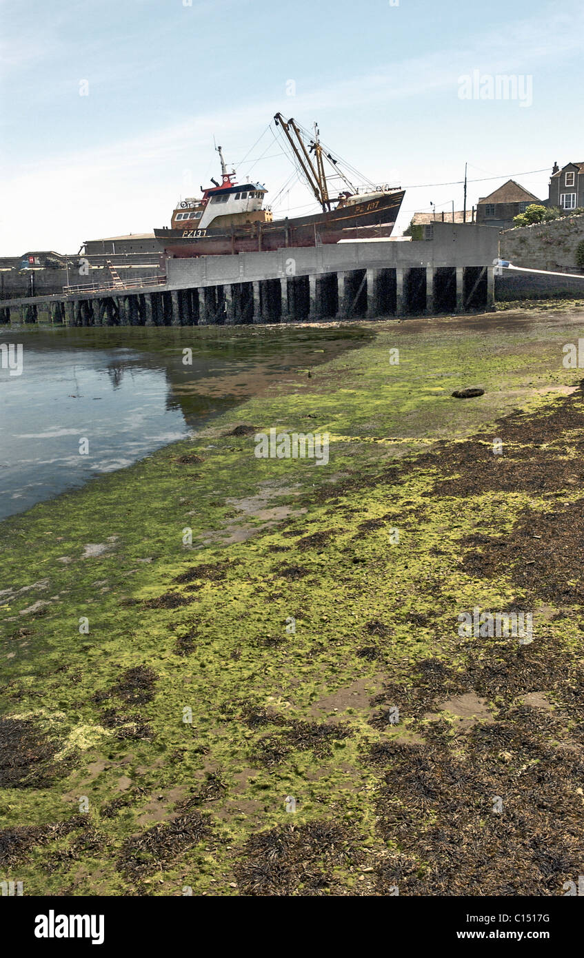 A beam trawler laid up on a slipway for repair at Newlyn in Cornwall ...