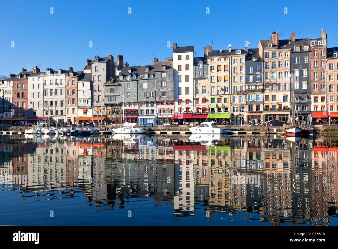 Honfleur harbour in Normandy, France. Color houses and their reflection ...