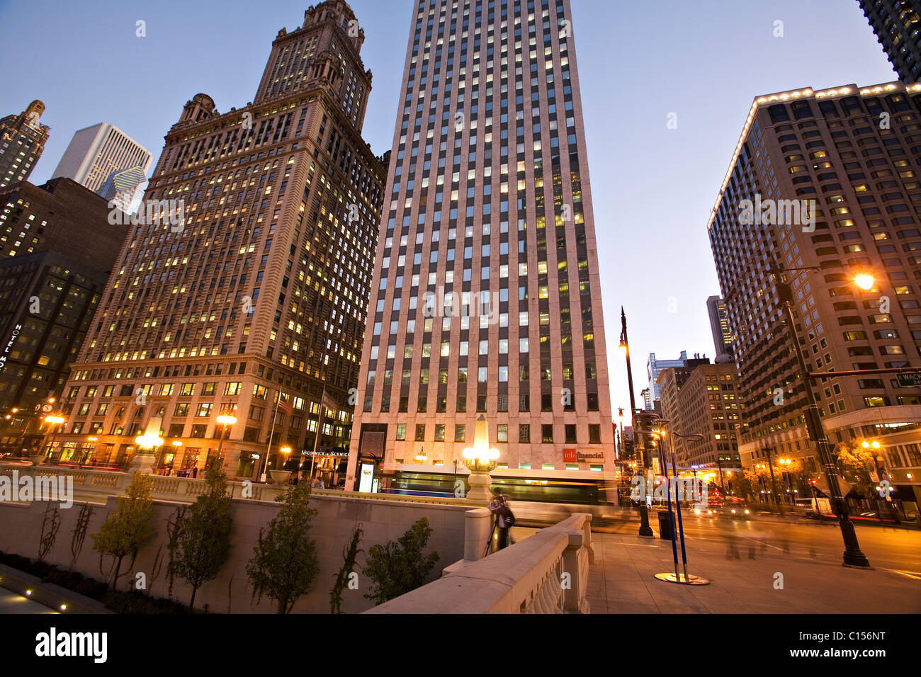 Pedestrian and street traffic at downtown intersection at dusk Stock ...