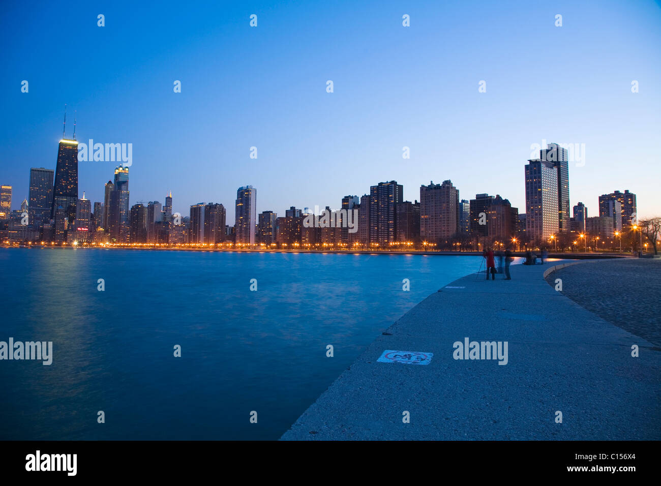 People photographing city skyline at dusk Stock Photo - Alamy