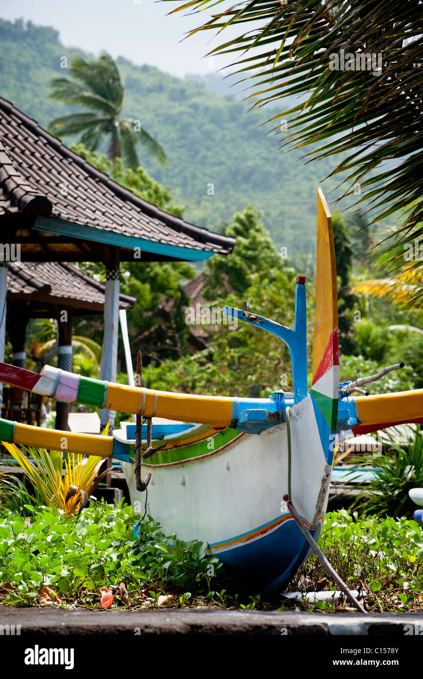 A traditional Balinese outrigger sailing fishing boat, called a jukung ...