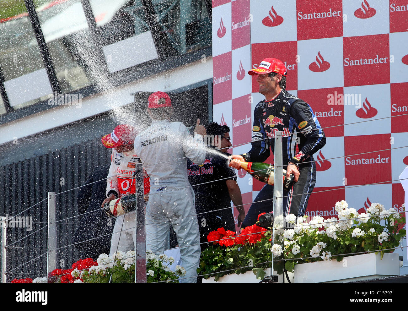 Mark Webber, Lewis Hamilton and Nico Rosberg celebrating on the podium ...