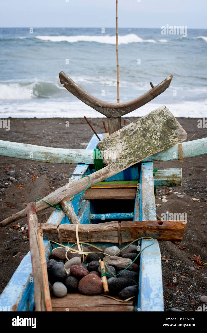 A traditional Balinese outrigger sailing fishing boat, called a jukung ...