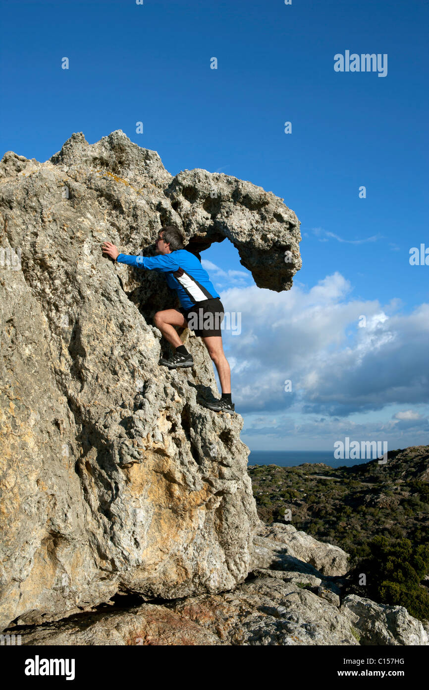Man scaling climbing wall hi-res stock photography and images - Alamy