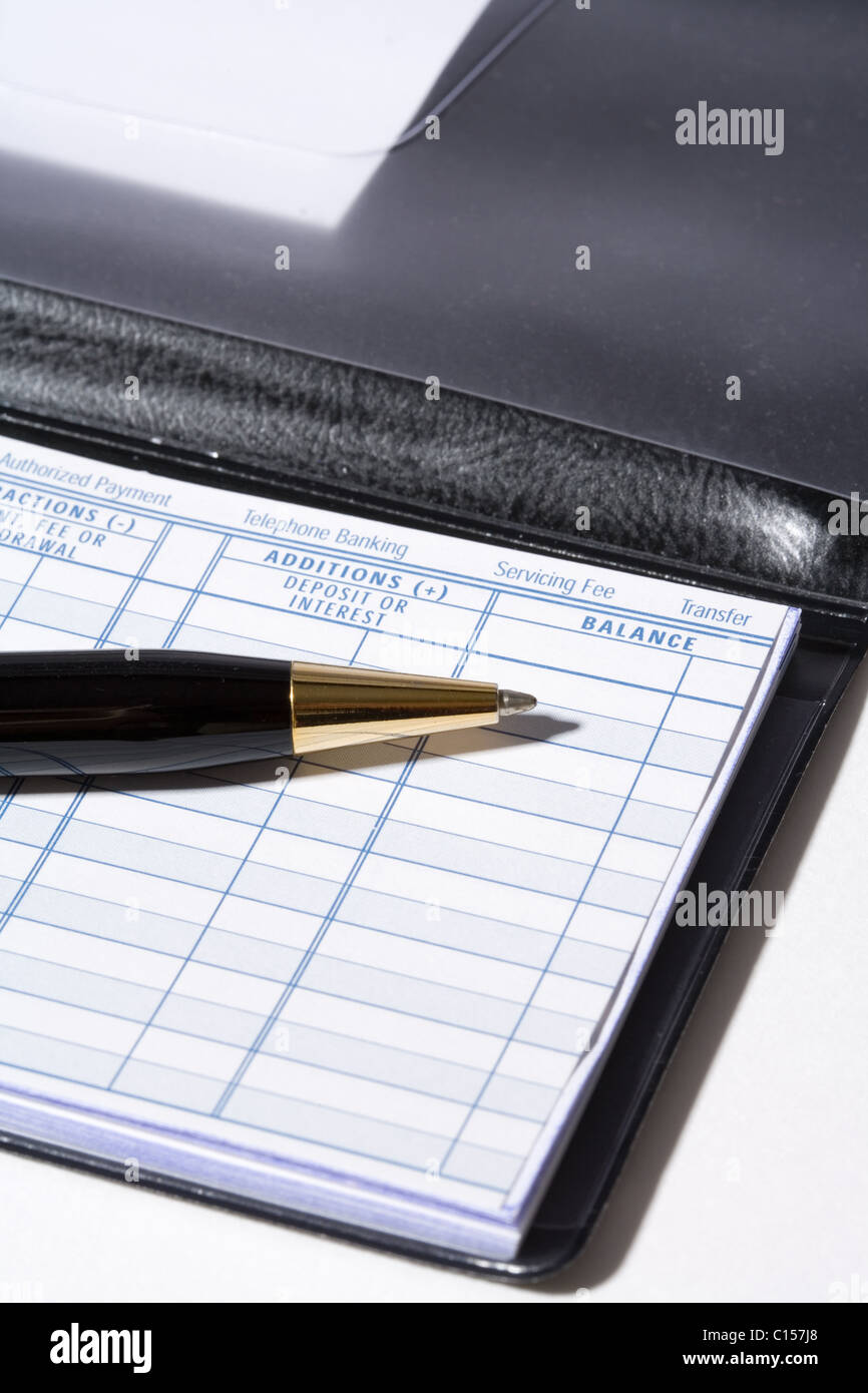 Checkbook and pen with white background Stock Photo - Alamy