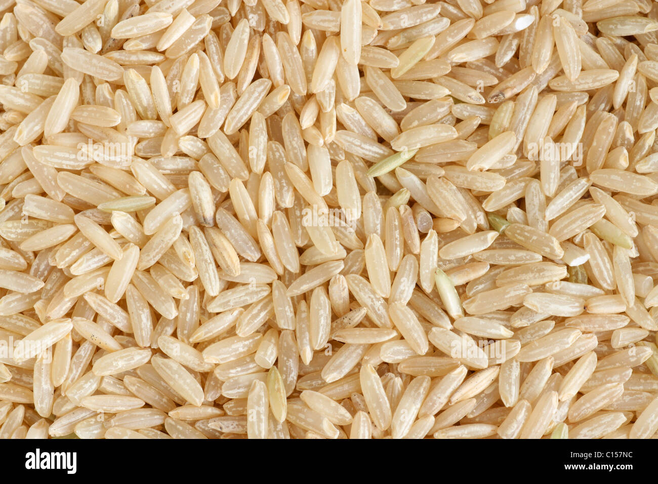 Uncooked long grain brown rice Stock Photo - Alamy