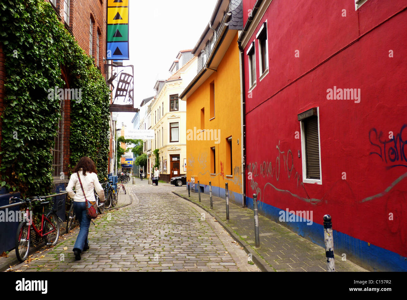 A woman walks in a street of the Viertel neighborhood - Bremen, Germany ...