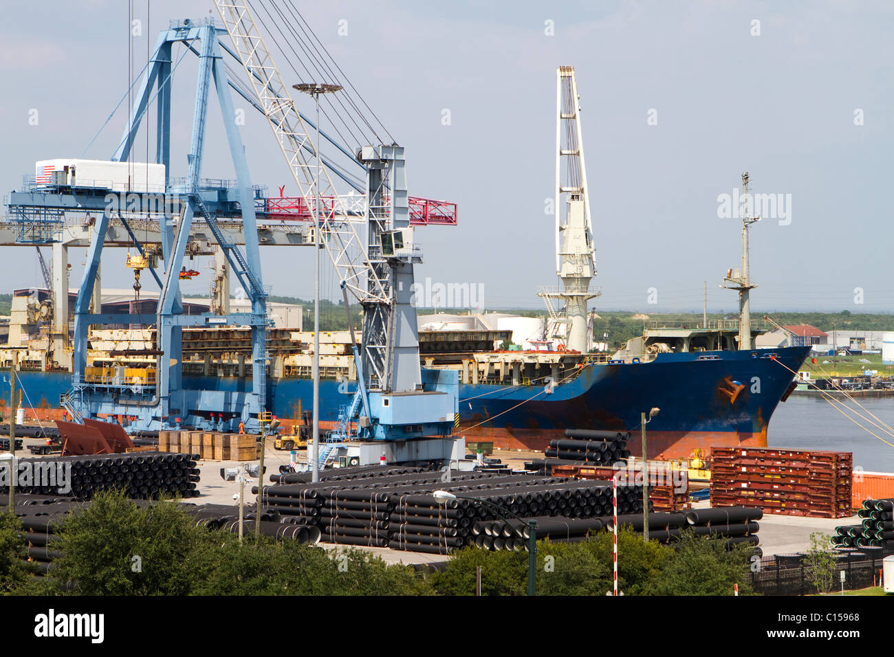 Container ship at dock is in the process of being loaded with freight ...