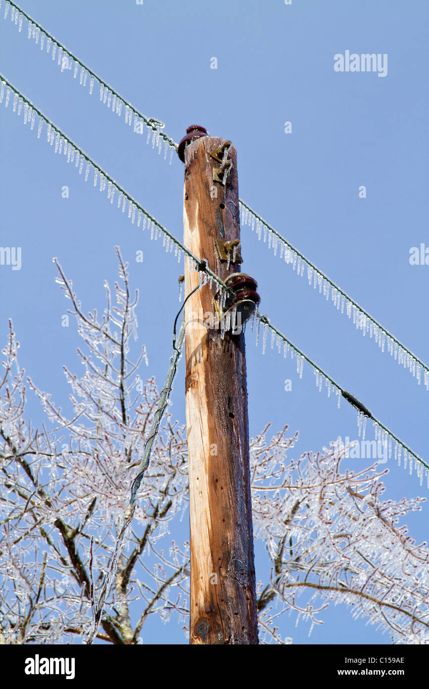 A winter ice storm, freezing rain, forms icicles and causes a power ...