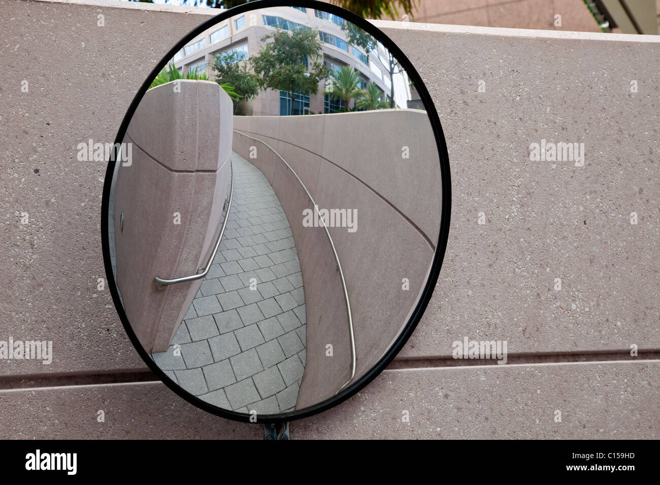 Mirror on the corner between corridors Stock Photo - Alamy