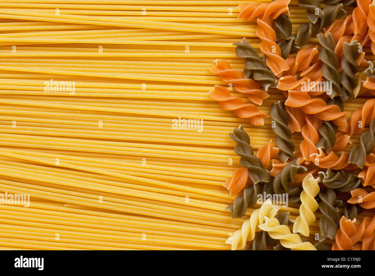 Closeup of spiral shaped pasta and spaghetti Stock Photo - Alamy