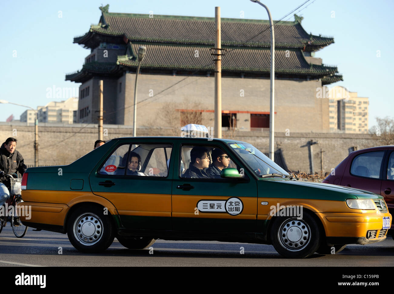 Taxi past a city gate in Beijing, China. 09-Mar-2011 Stock Photo - Alamy